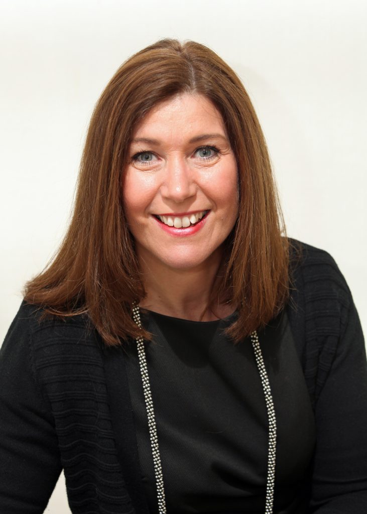 Portrait of a Woman with Long Brown Hair - HeadStart Exeter